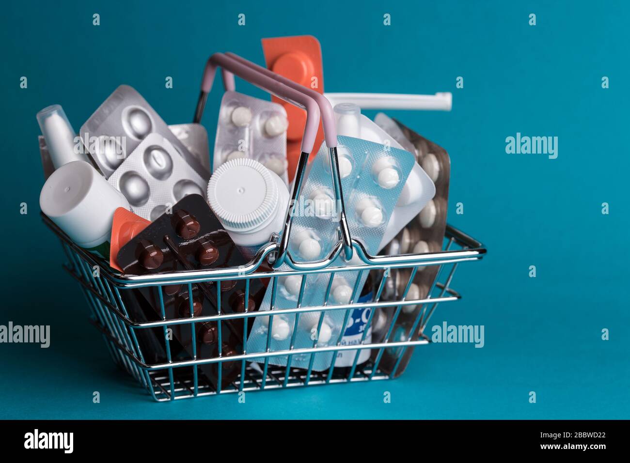 Prices for shopping consumer basket products with medicines on a blue ...