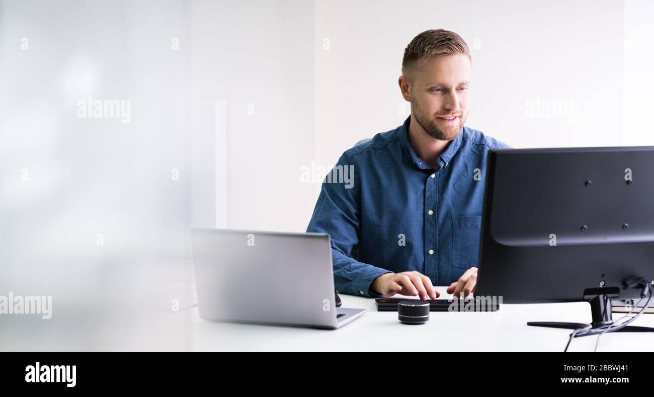 Man Working On Laptop Computer Doing Business Stock Photo - Alamy
