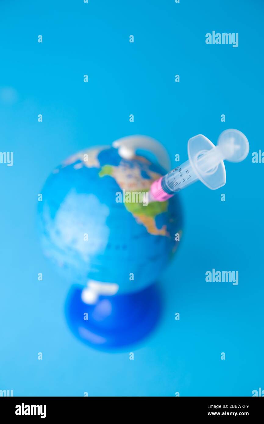 Syringe inject vaccine into the earth, concept of vaccination save ...