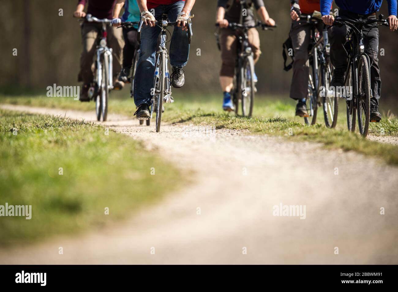 mixed group of cyclists biking Stock Photo - Alamy
