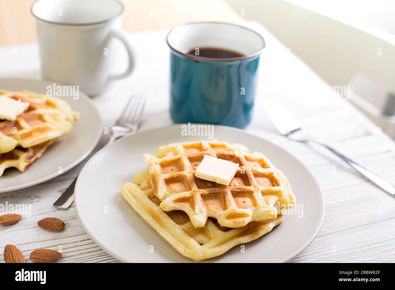 breakfast - Belgian waffles and cup with tea Stock Photo - Alamy