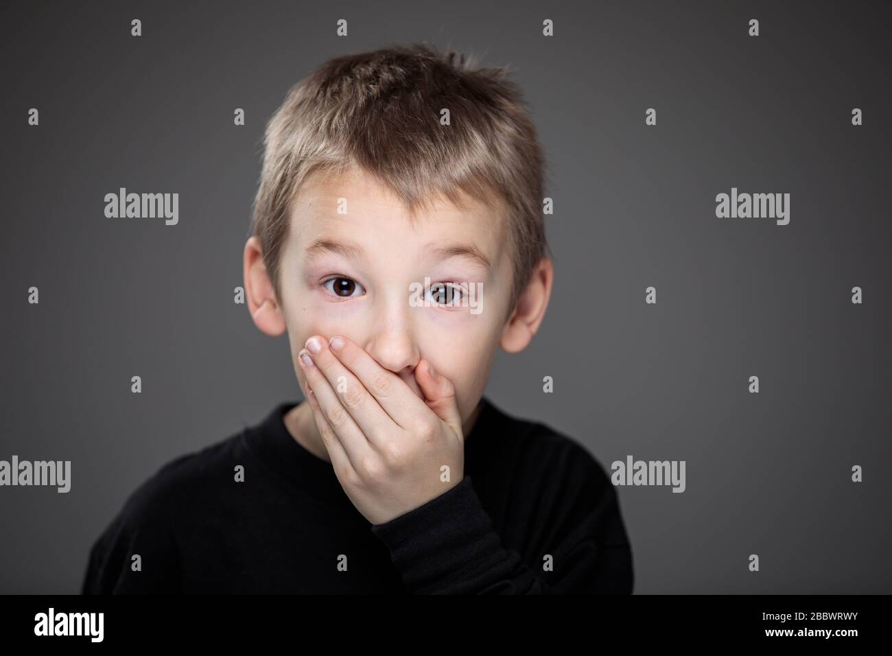 Grief-stricken little boy - feeling intense sorrow, remorse, sadnesss ...