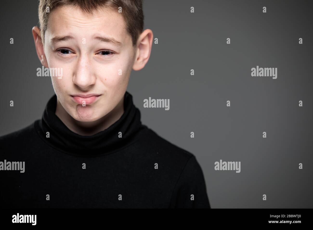 Grief-stricken little boy - feeling intense sorrow, remorse, sadnesss ...