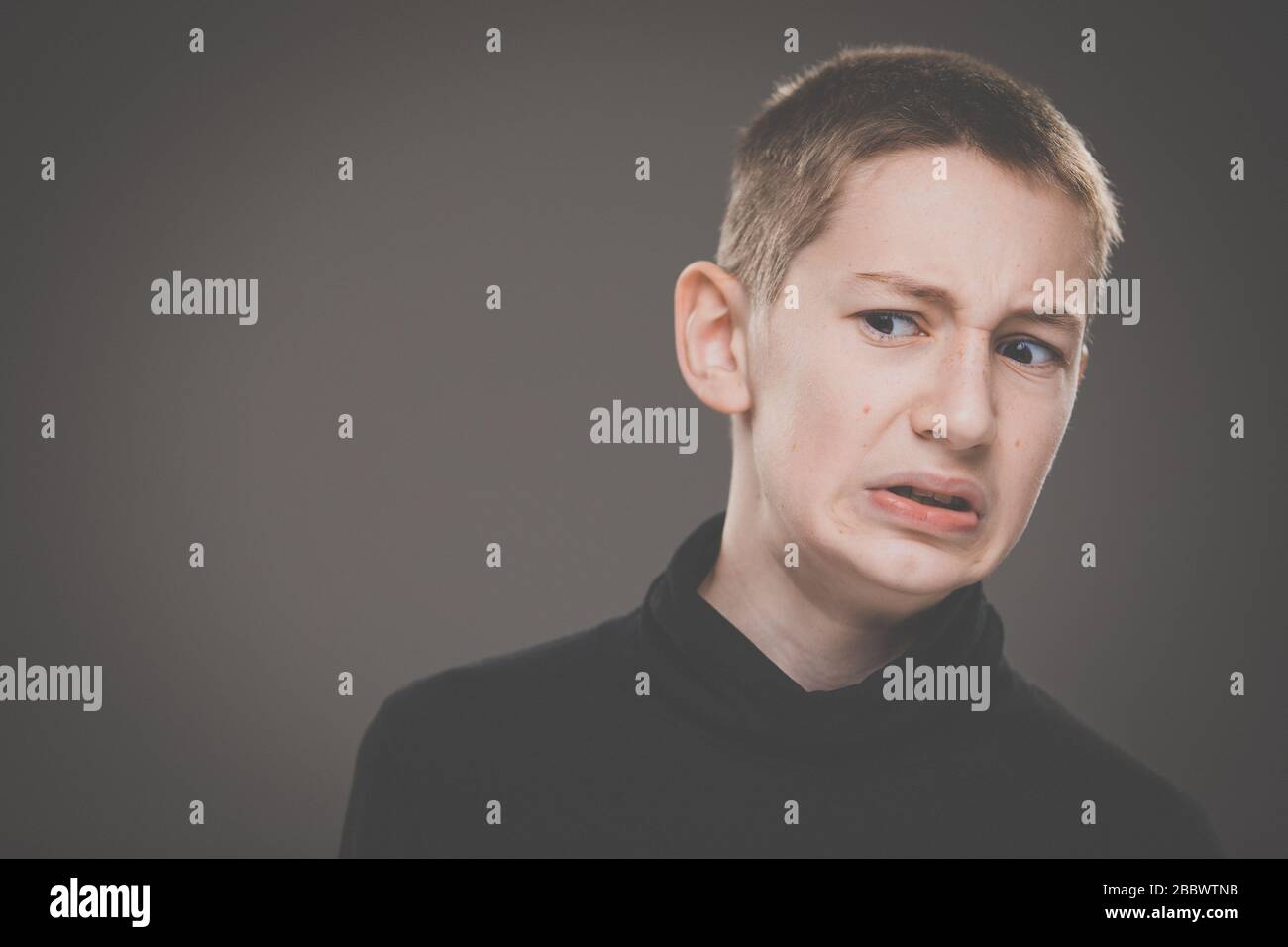 Grief-stricken little boy - feeling intense sorrow, remorse, sadnesss ...