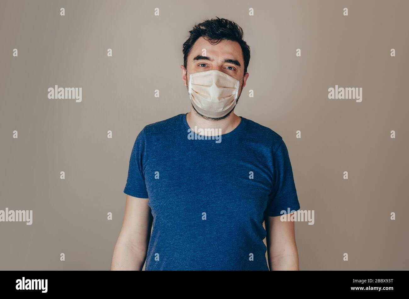 Male in the face mask looking in front of eyes Stock Photo - Alamy