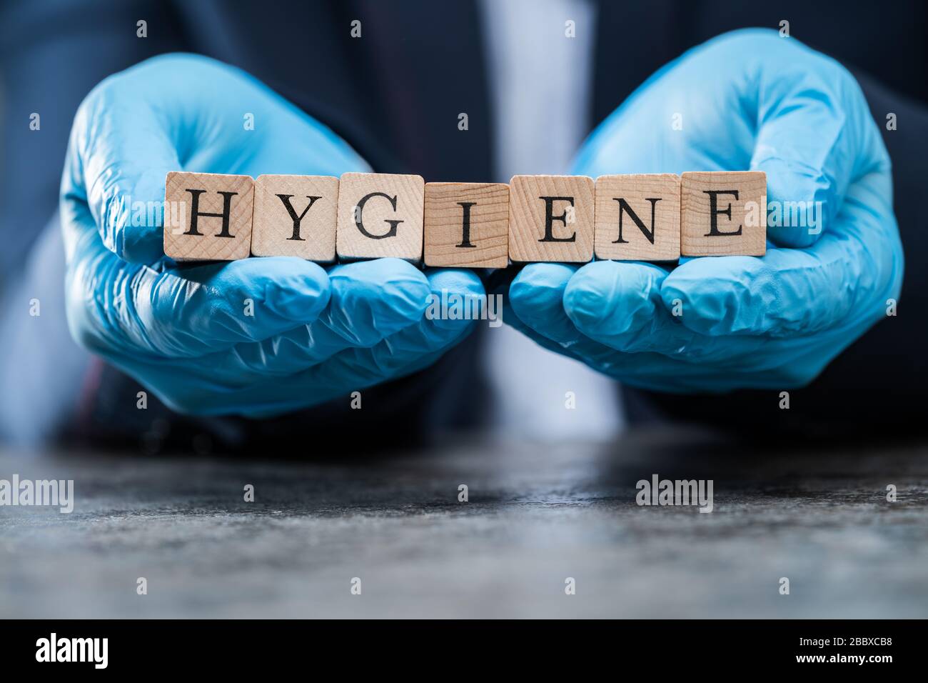 Hand In Gloves Holding Hygiene Word. Coronavirus Concept Stock Photo ...