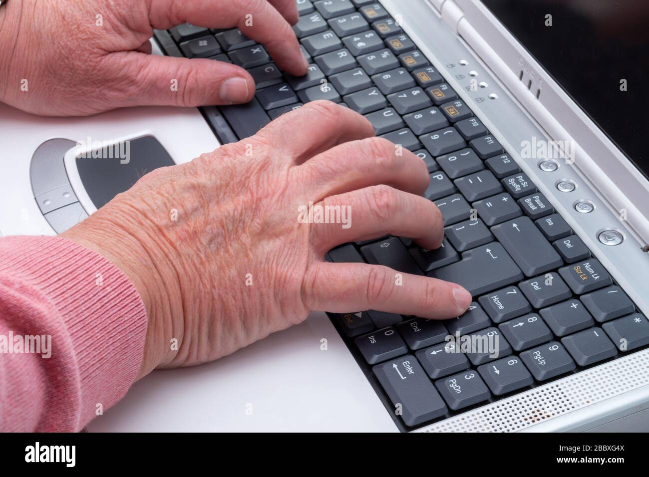 An elderly mans hands on a computer keyboard Stock Photo - Alamy