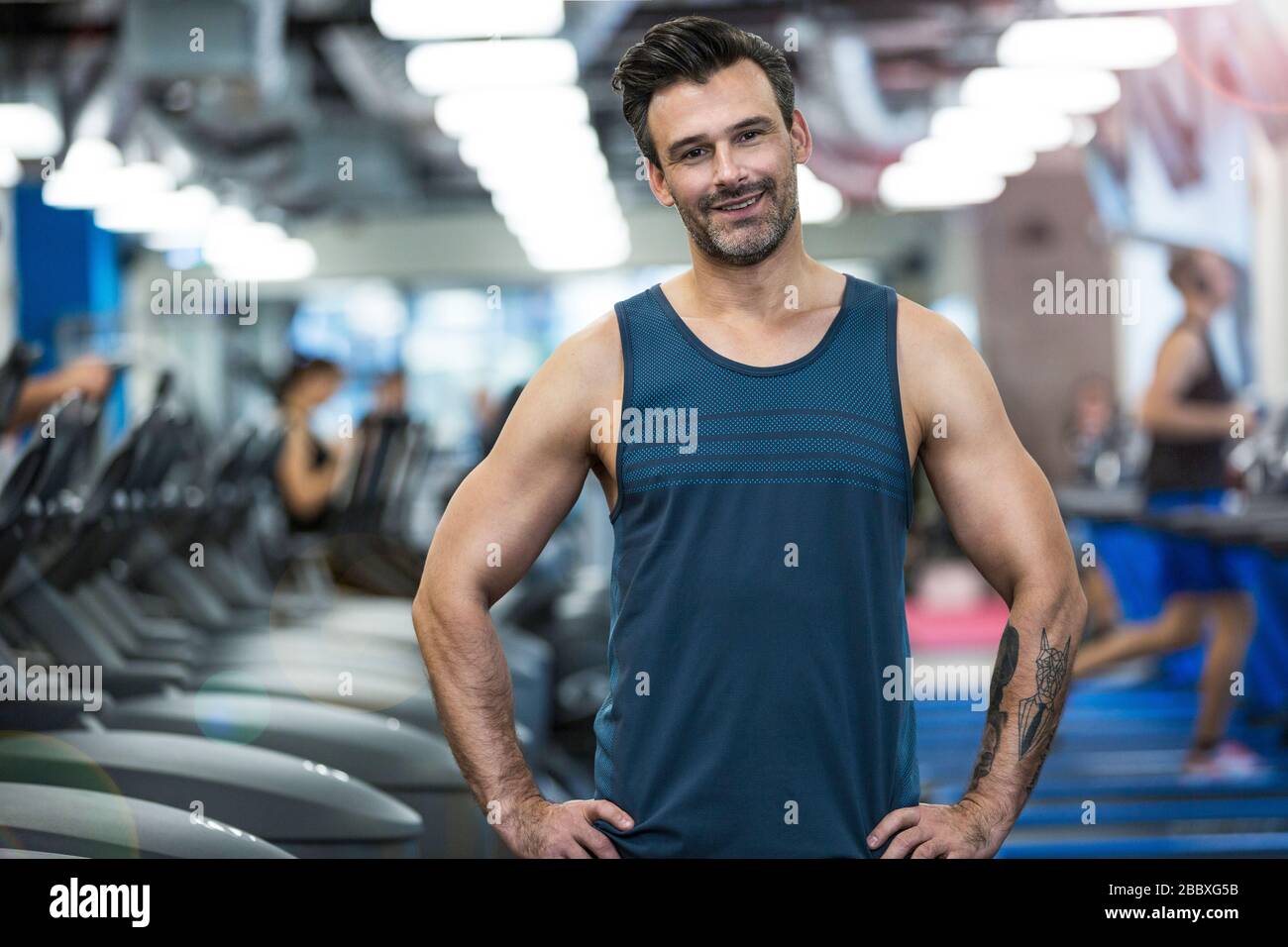 Man working out in gym Stock Photo - Alamy