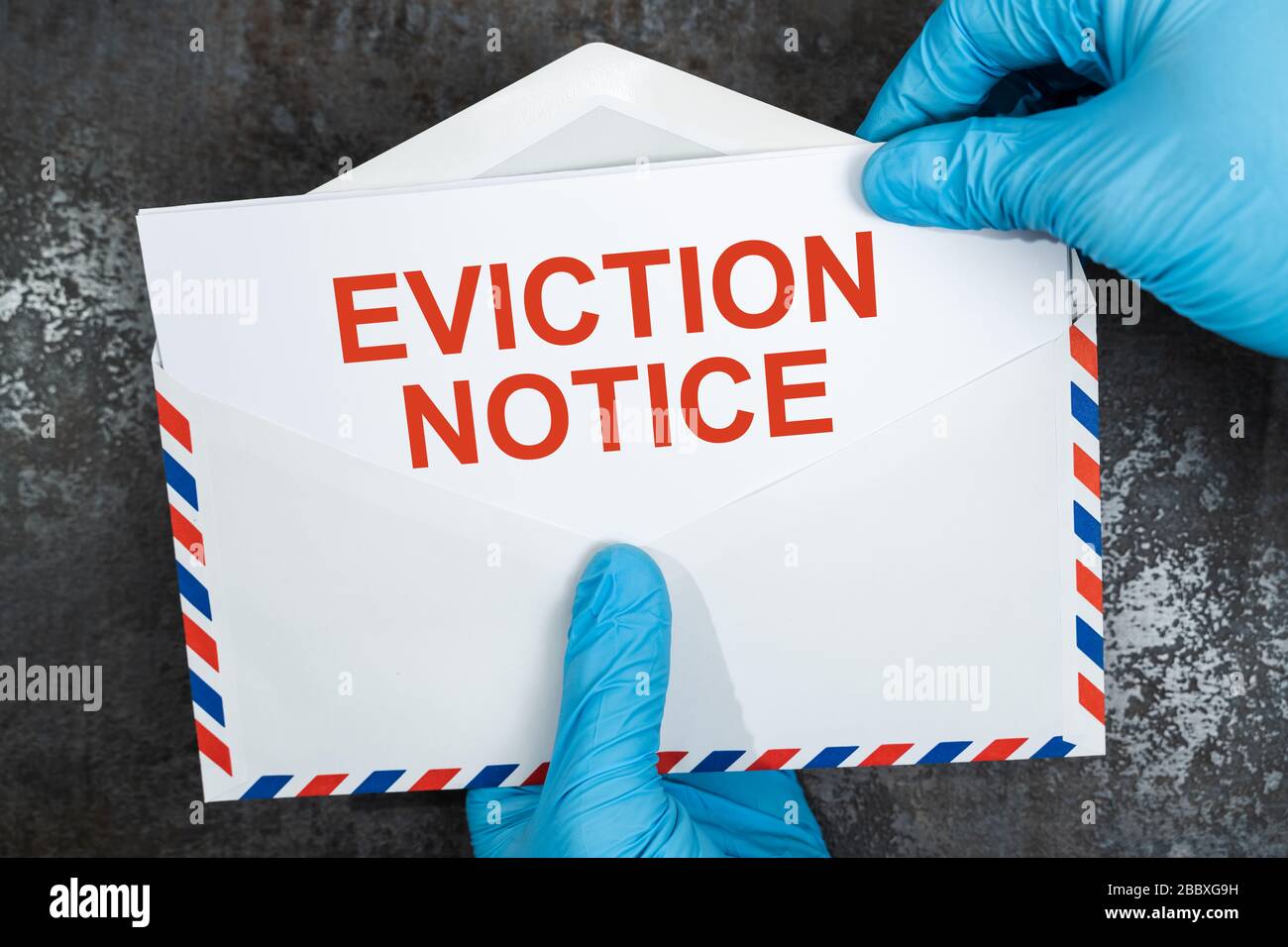 Man holding an eviction notice sign hi-res stock photography and images ...