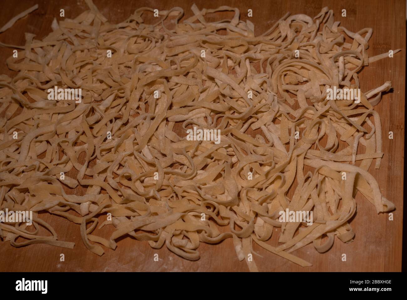 Raw yellow italian pasta. Egg homemade noodles cooking process ...