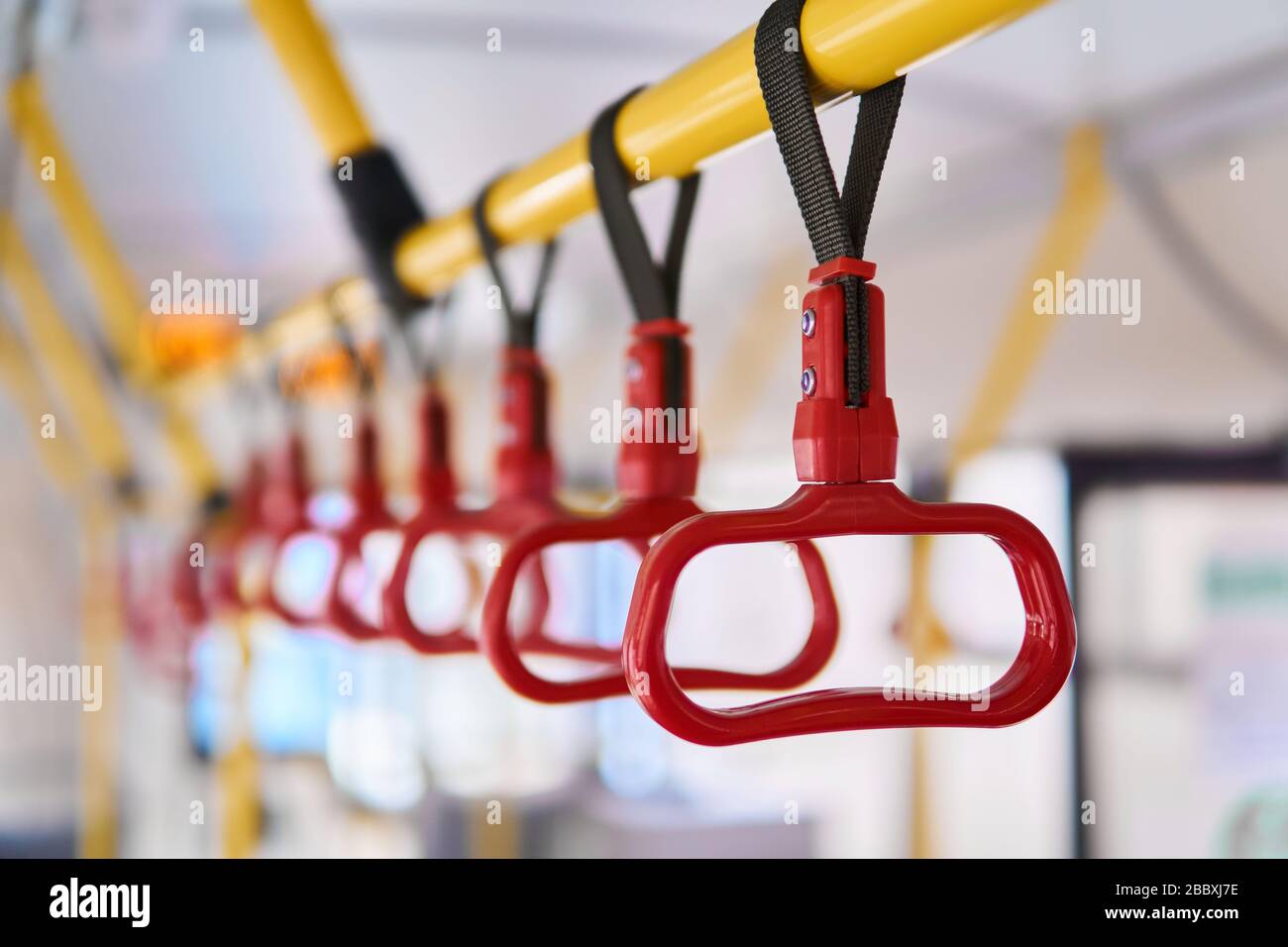 interior elements of public transport - city bus grab handles for ...