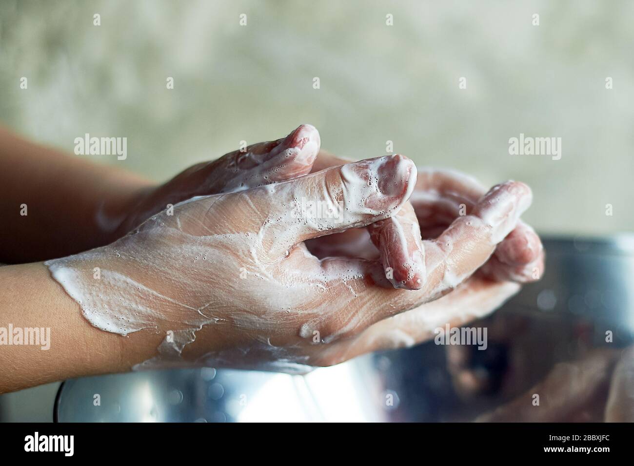Child washing hand warm water hi-res stock photography and images - Alamy
