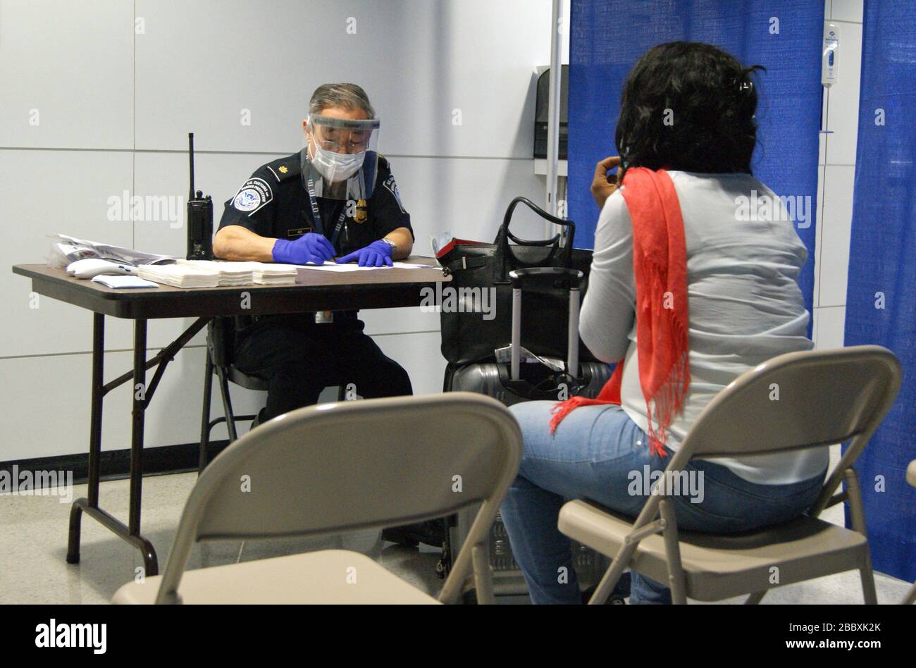 CBP Supervisor conducts an interview with a passenger arriving from ...