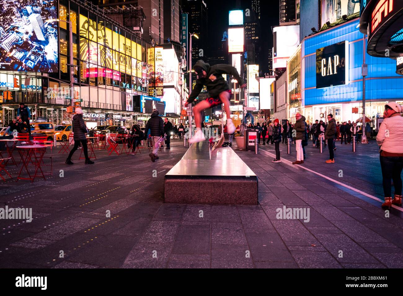 Times Square, is a busy tourist intersection of neon art and commerce ...