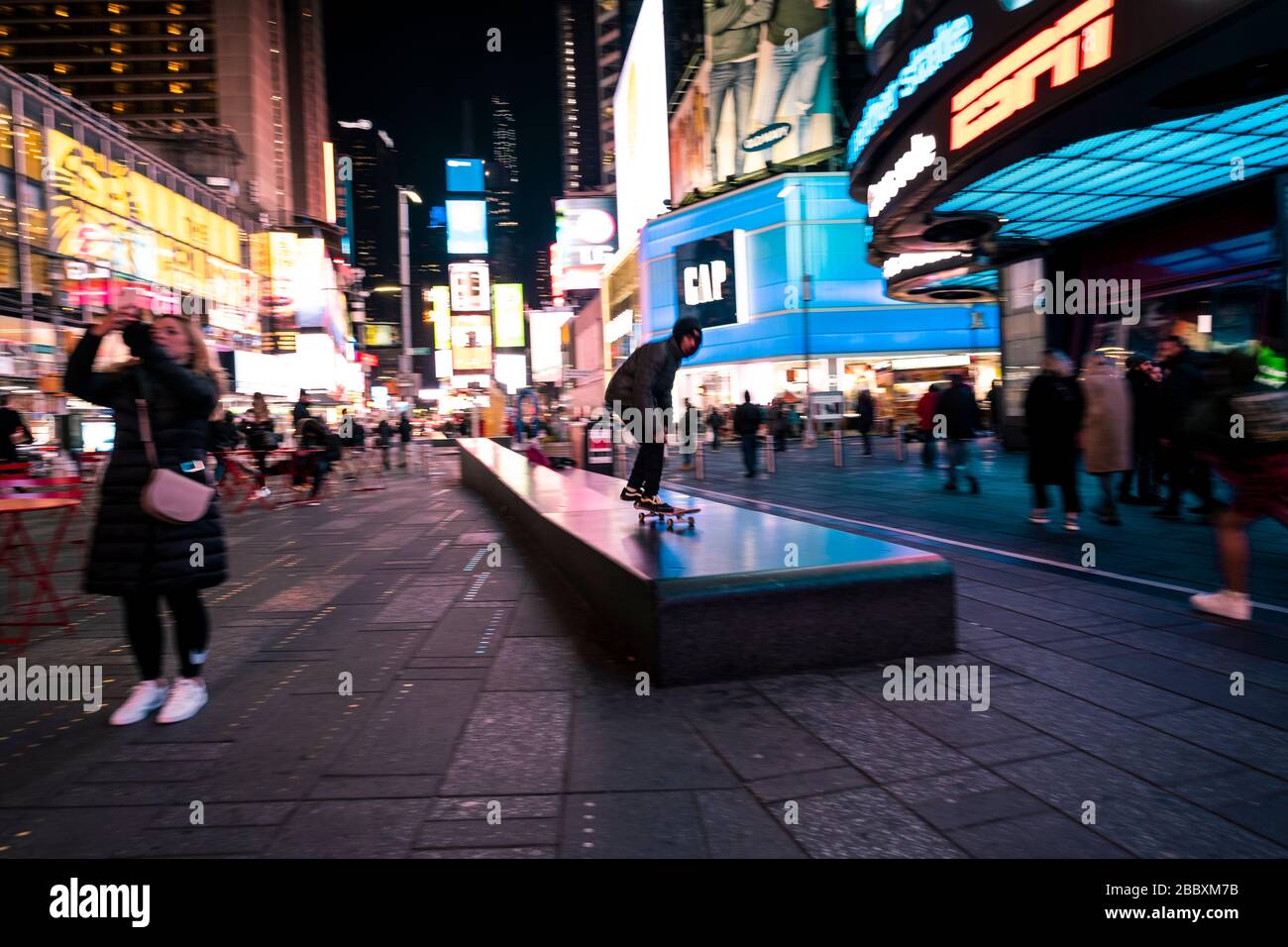 Times Square, is a busy tourist intersection of neon art and commerce ...