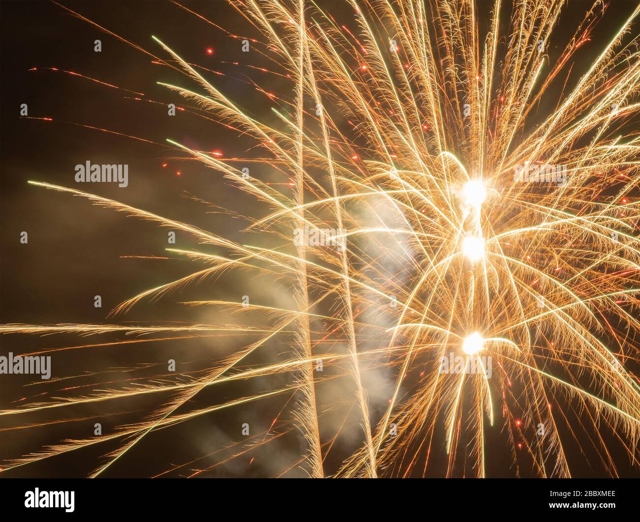Close-up photo of bright fireworks with many branches and sparks in ...