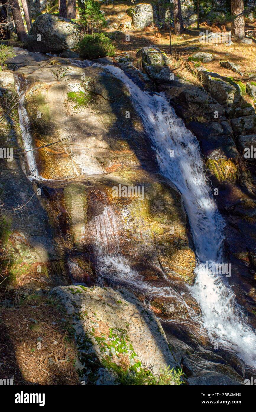 vertical landscape photograph of a natural waterfall improvised by the ...