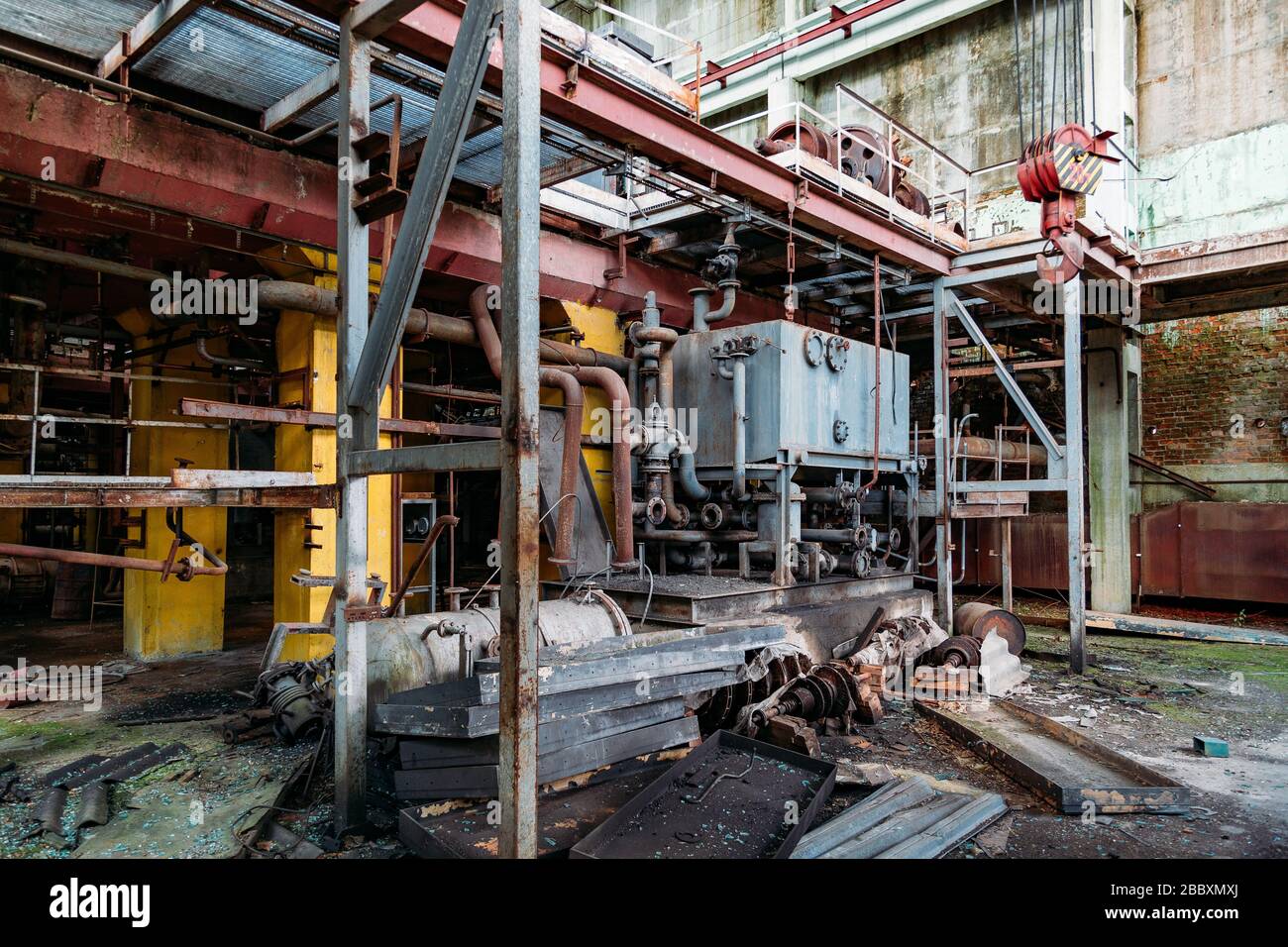 Old rusty Industrial tanks connected by pipes connected with valves in ...