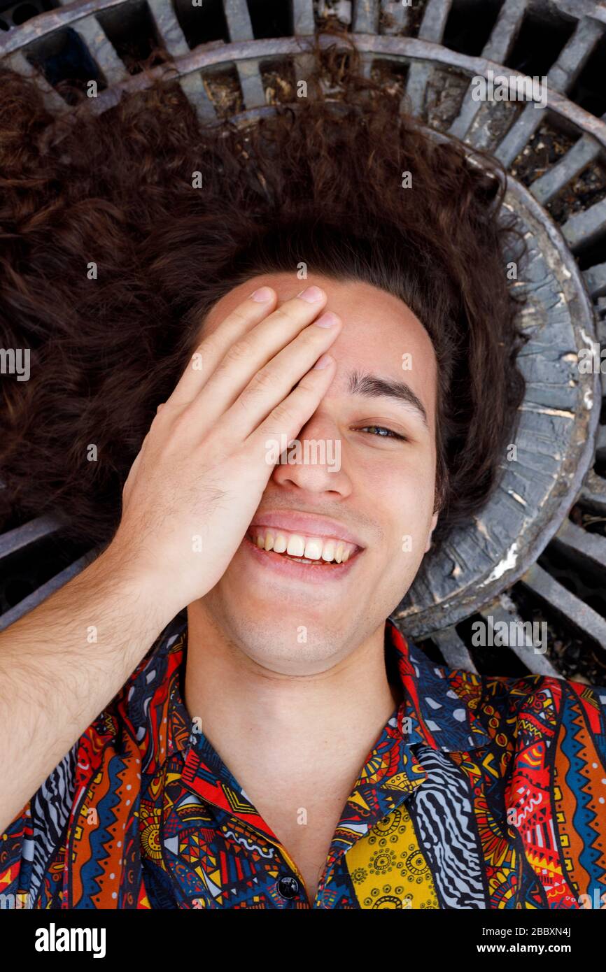 Man hide mouth hand hi-res stock photography and images - Alamy