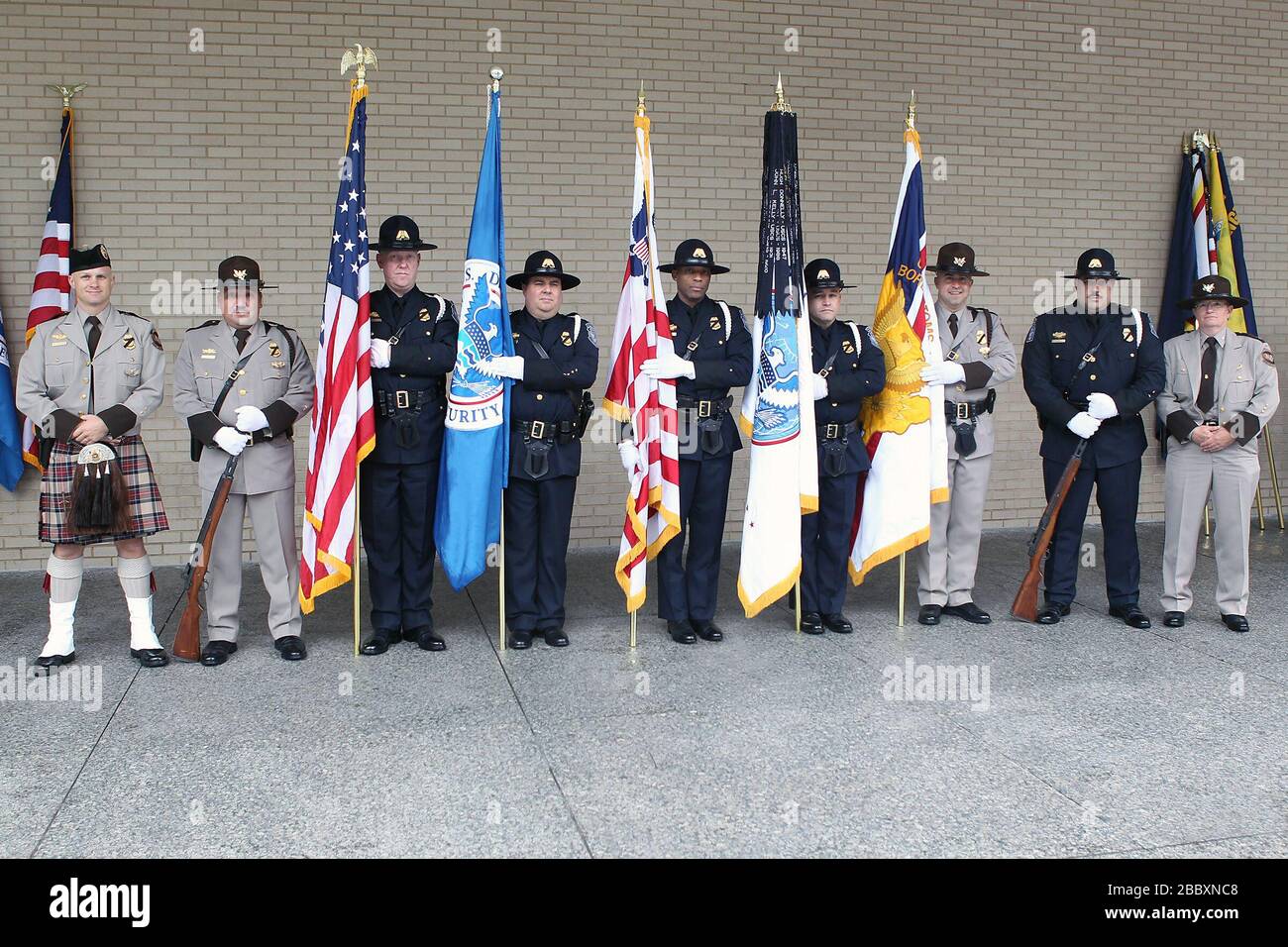 The U.S. Customs and Border Protection Honor Guard stop to pose for a ...