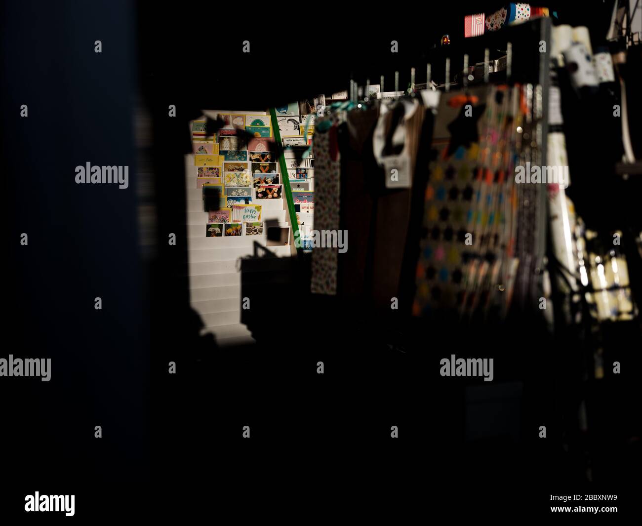 Sunlight comes through the window of a temporary closed retail store ...