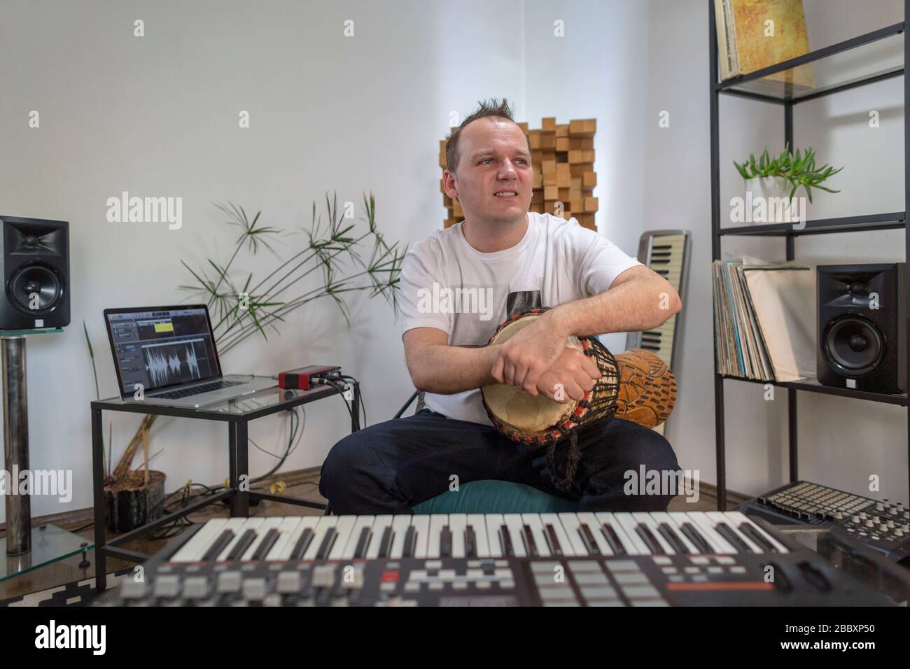 Professional musician having wrist pain while playing djembe music ...