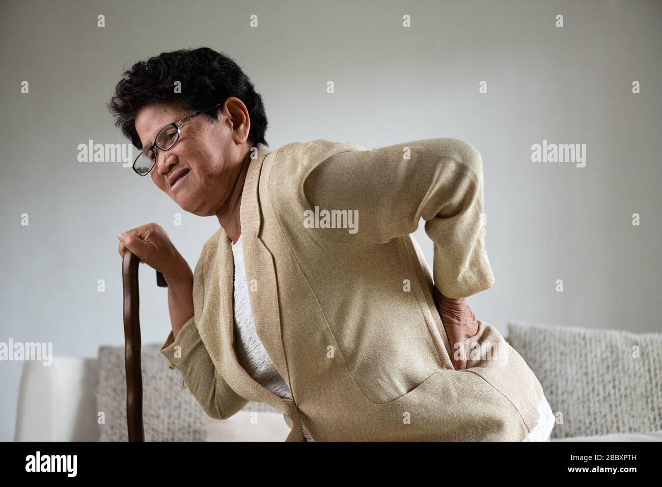 Old woman having back pain hi-res stock photography and images - Alamy