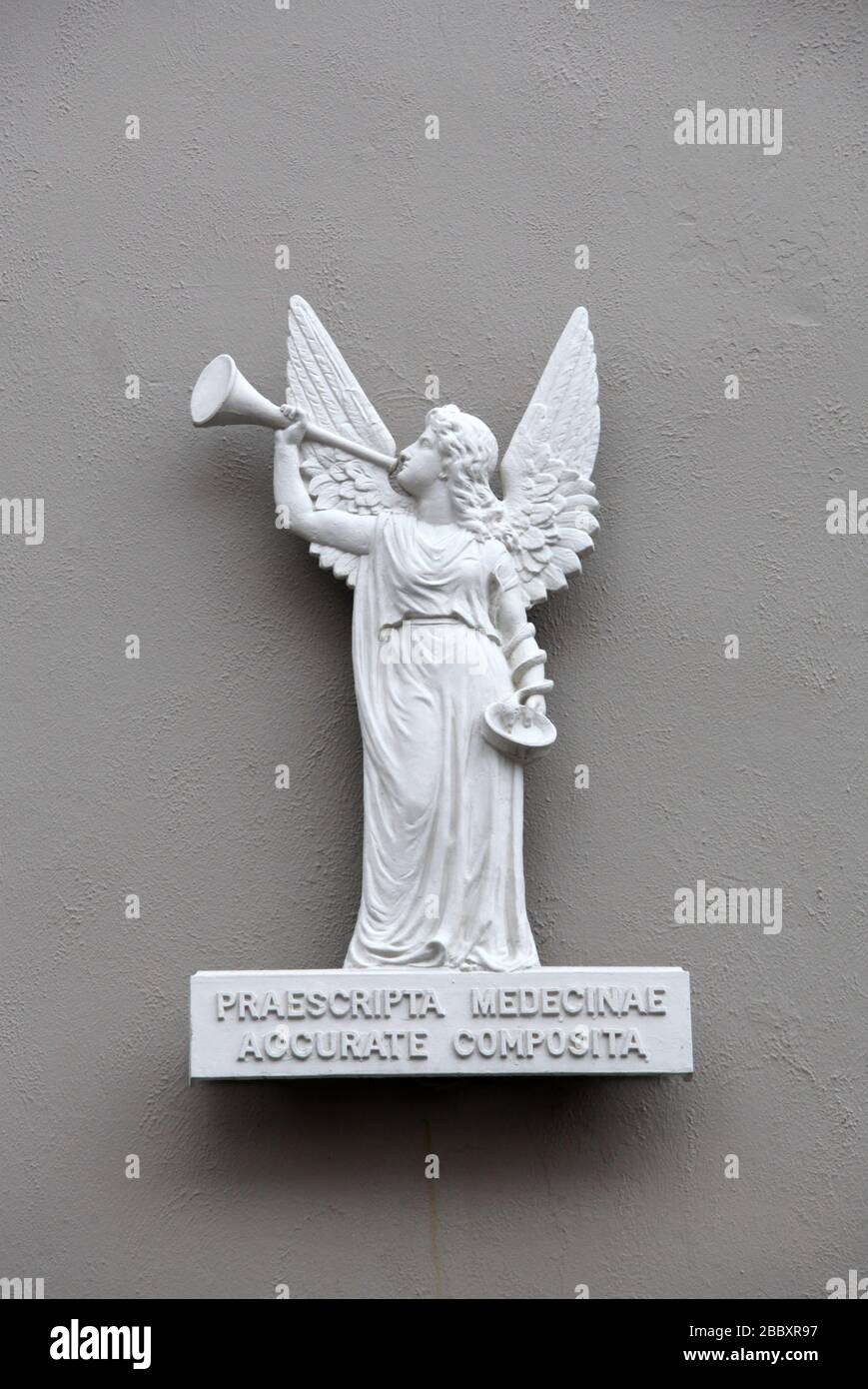 Wall mounted angel on a building at Grafton Street in Dublin city ...