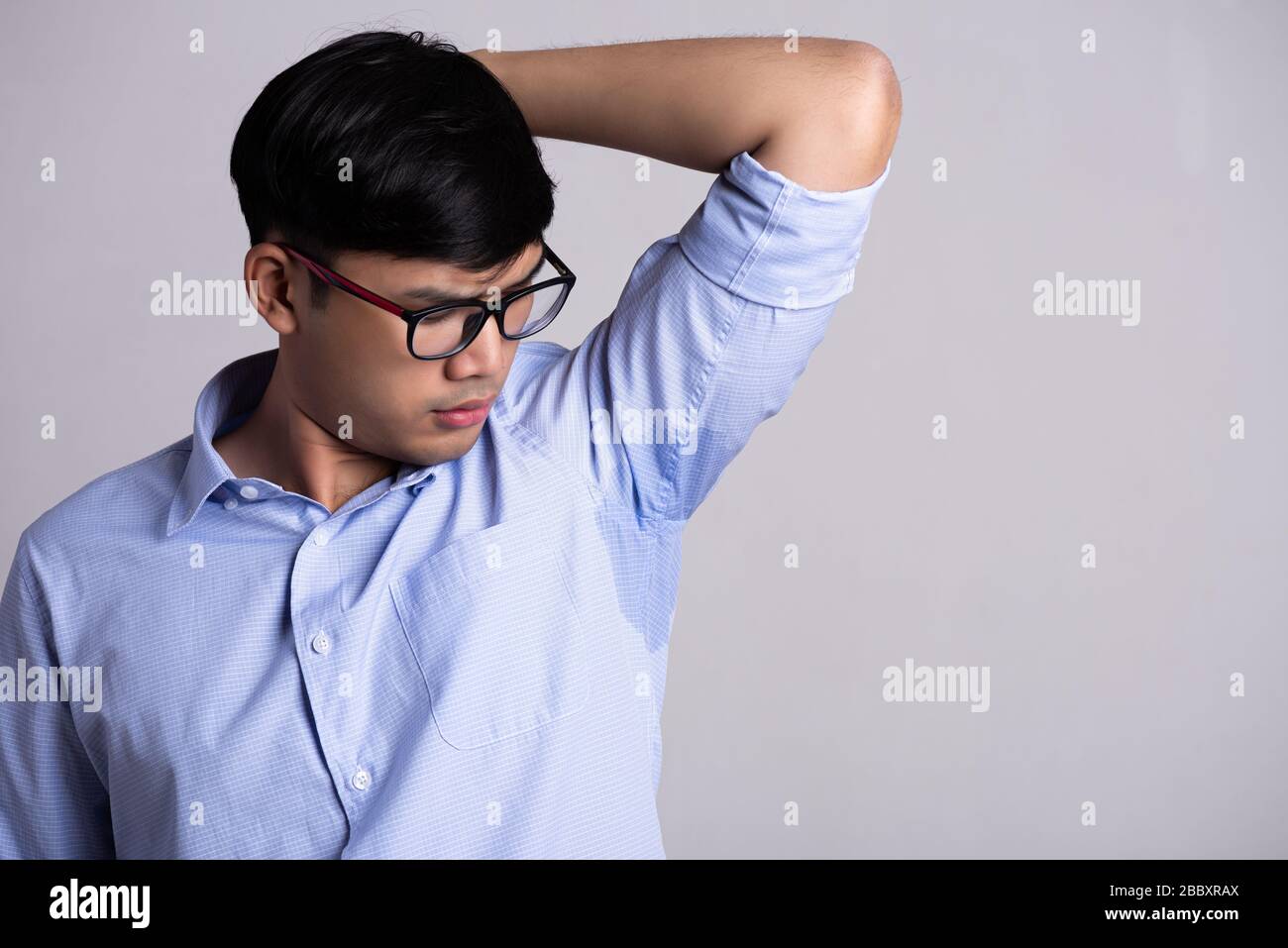Close up asian man with hyperhidrosis sweating. Young asia man with ...