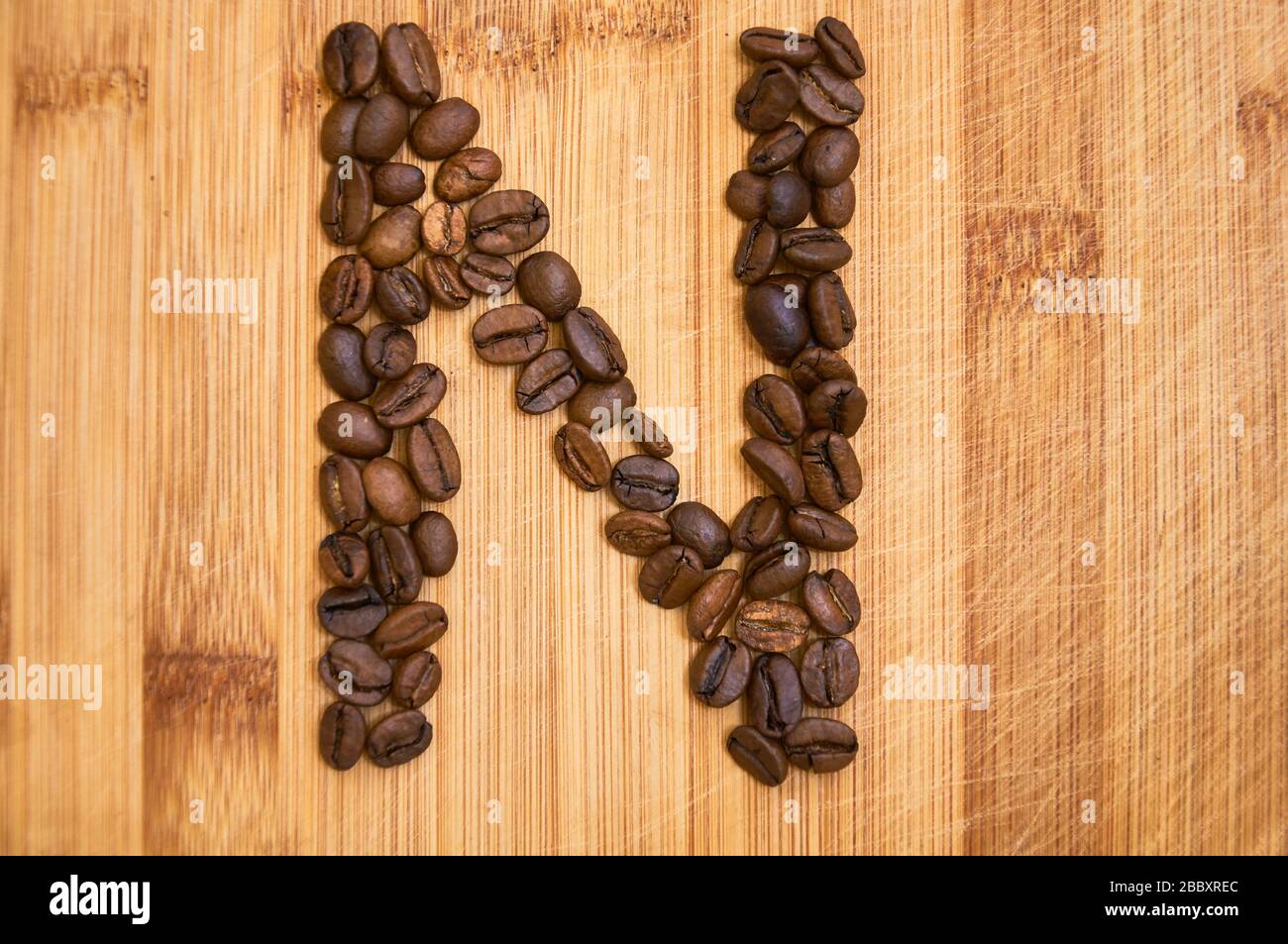 Alphabet letter N made from roasted coffee beans, 3D rendering on ...
