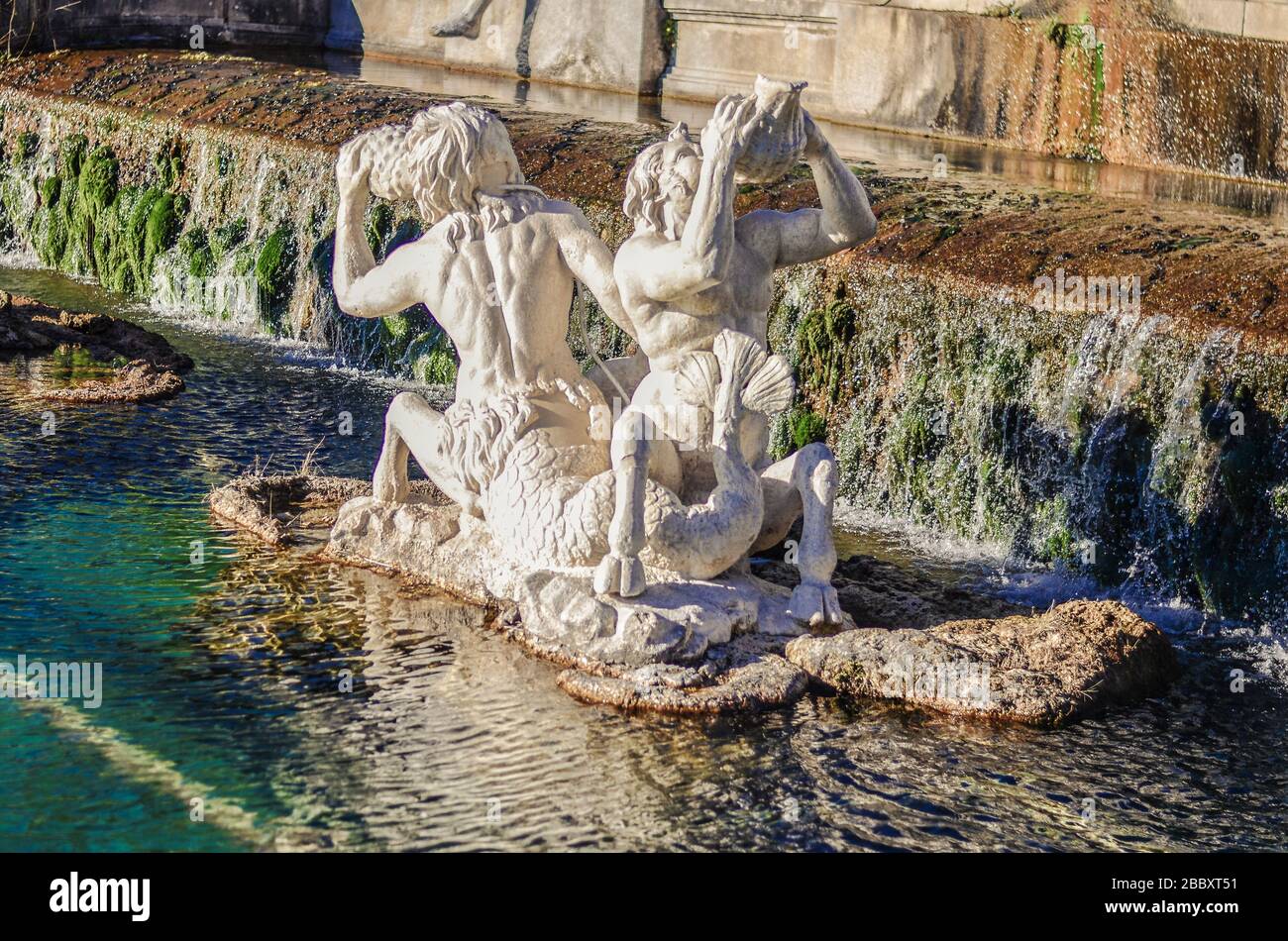 a beautiful fountain with statues and rocks Stock Photo - Alamy