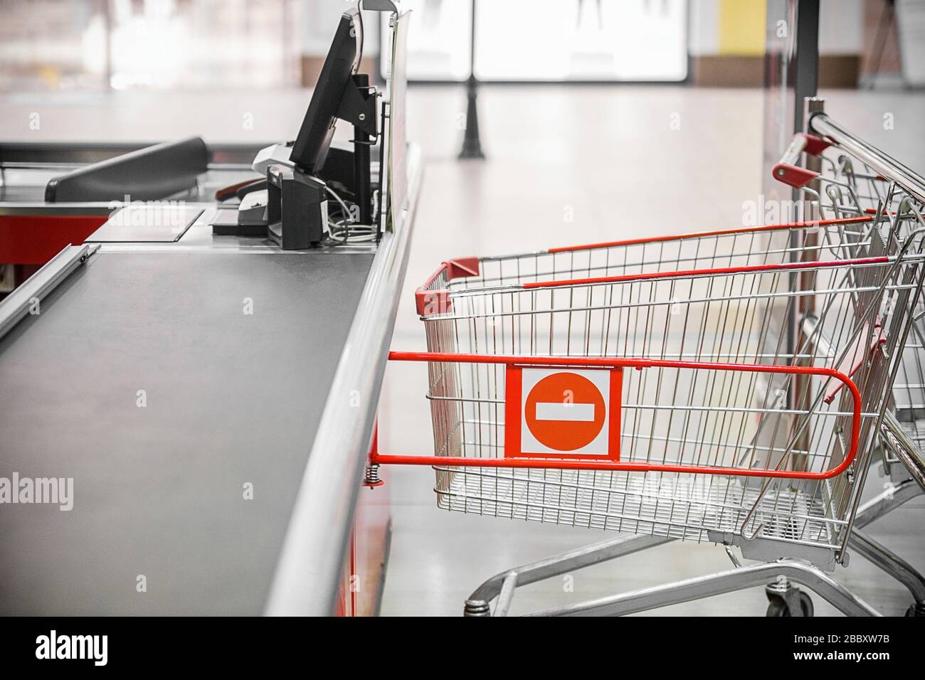 Empty cash desk with closed way border in supermarket Stock Photo - Alamy