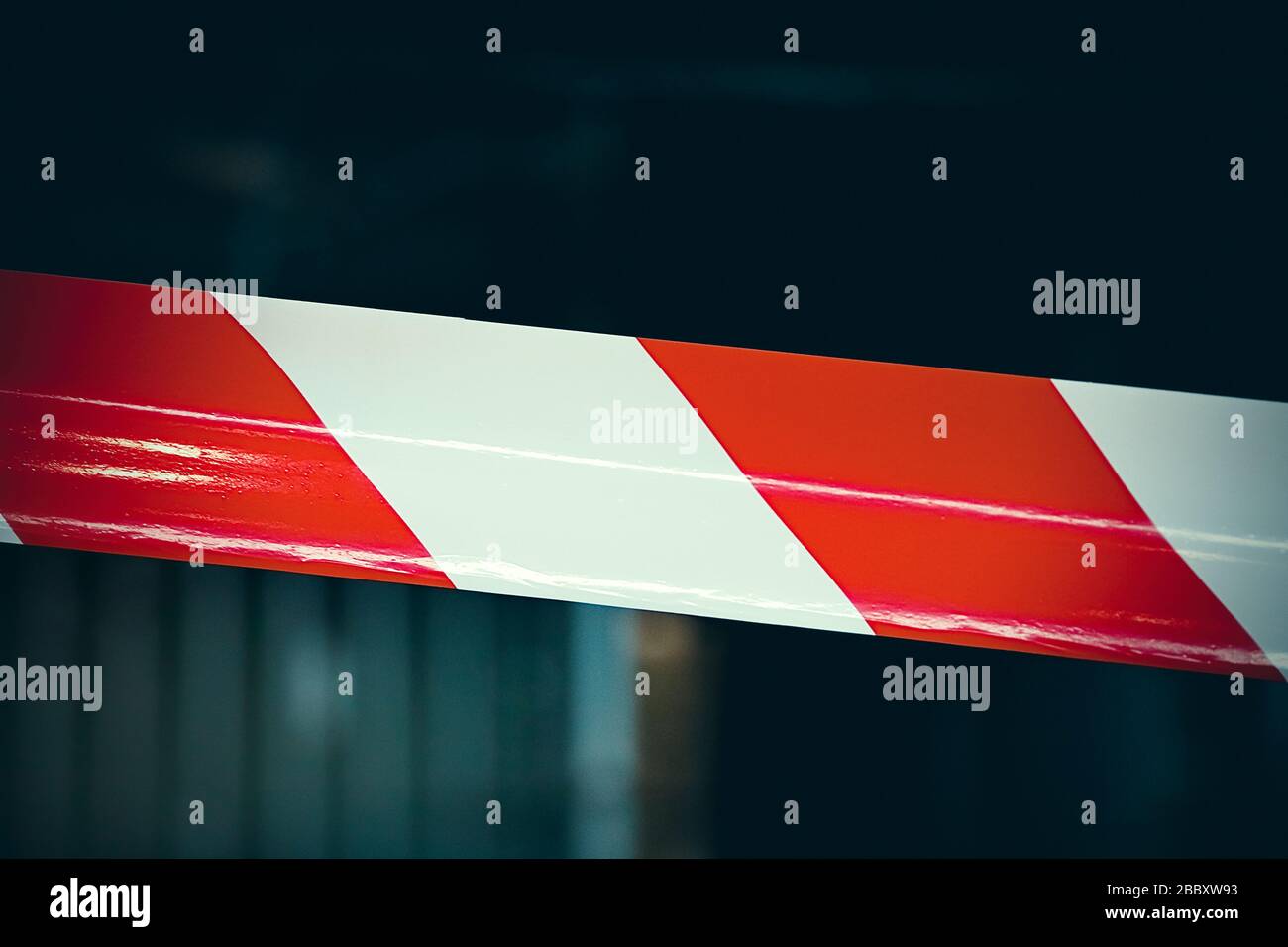 Red and white, striped protective tape protects the enclosed area ...