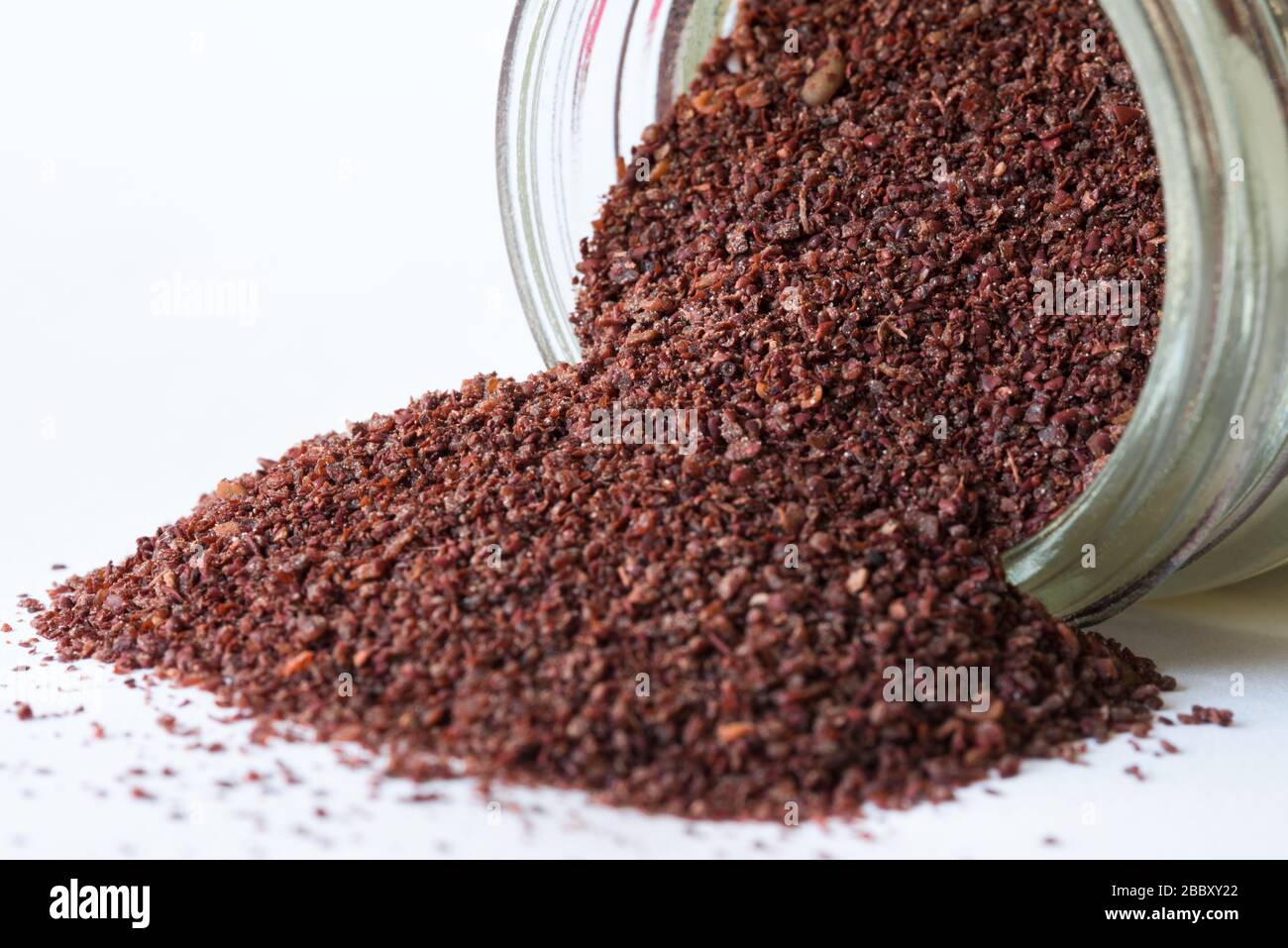 Ground Sumac Spilled from a Spice Jar Stock Photo - Alamy
