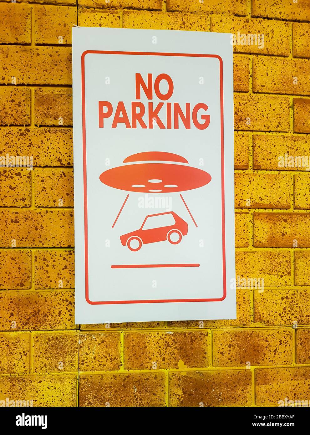 Hilarious No Parking Sign Board with Alien Spaceship Stock Photo - Alamy