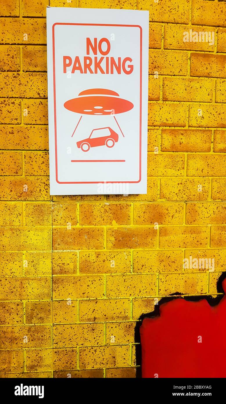 Hilarious No Parking Sign Board with Alien Spaceship Stock Photo - Alamy