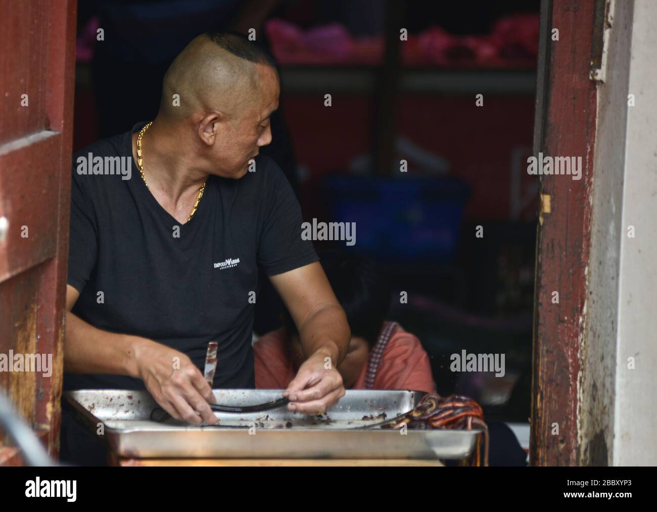A chinese fish vendor in his store in Shanghai Old Town. Huangpu. China ...