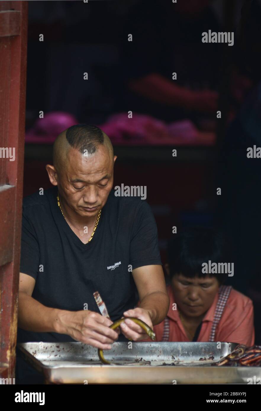 A chinese fish vendor in his store in Shanghai Old Town. Huangpu. China ...