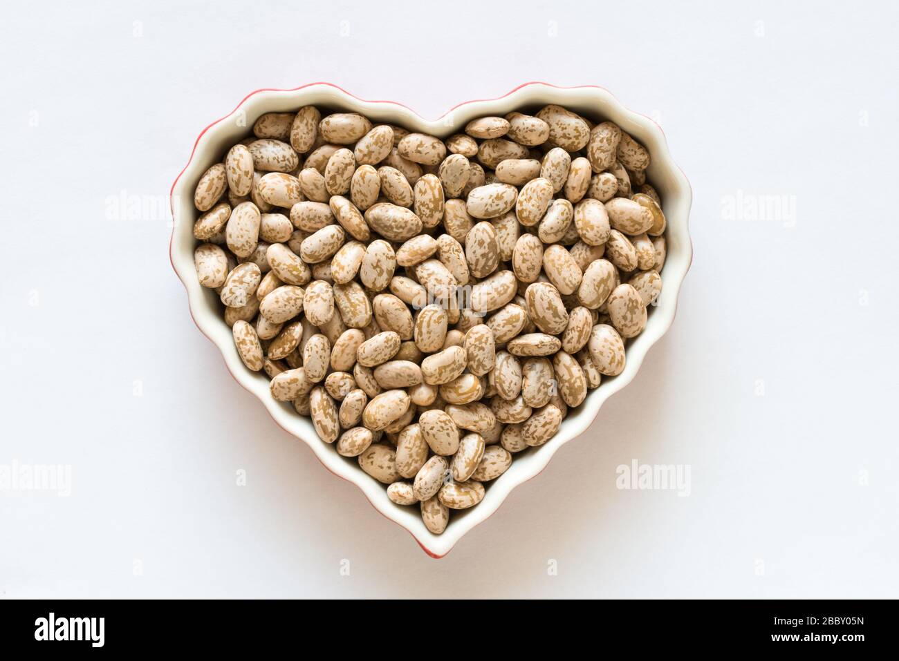 Uncooked Pinto Beans in a Heart Shape Stock Photo - Alamy