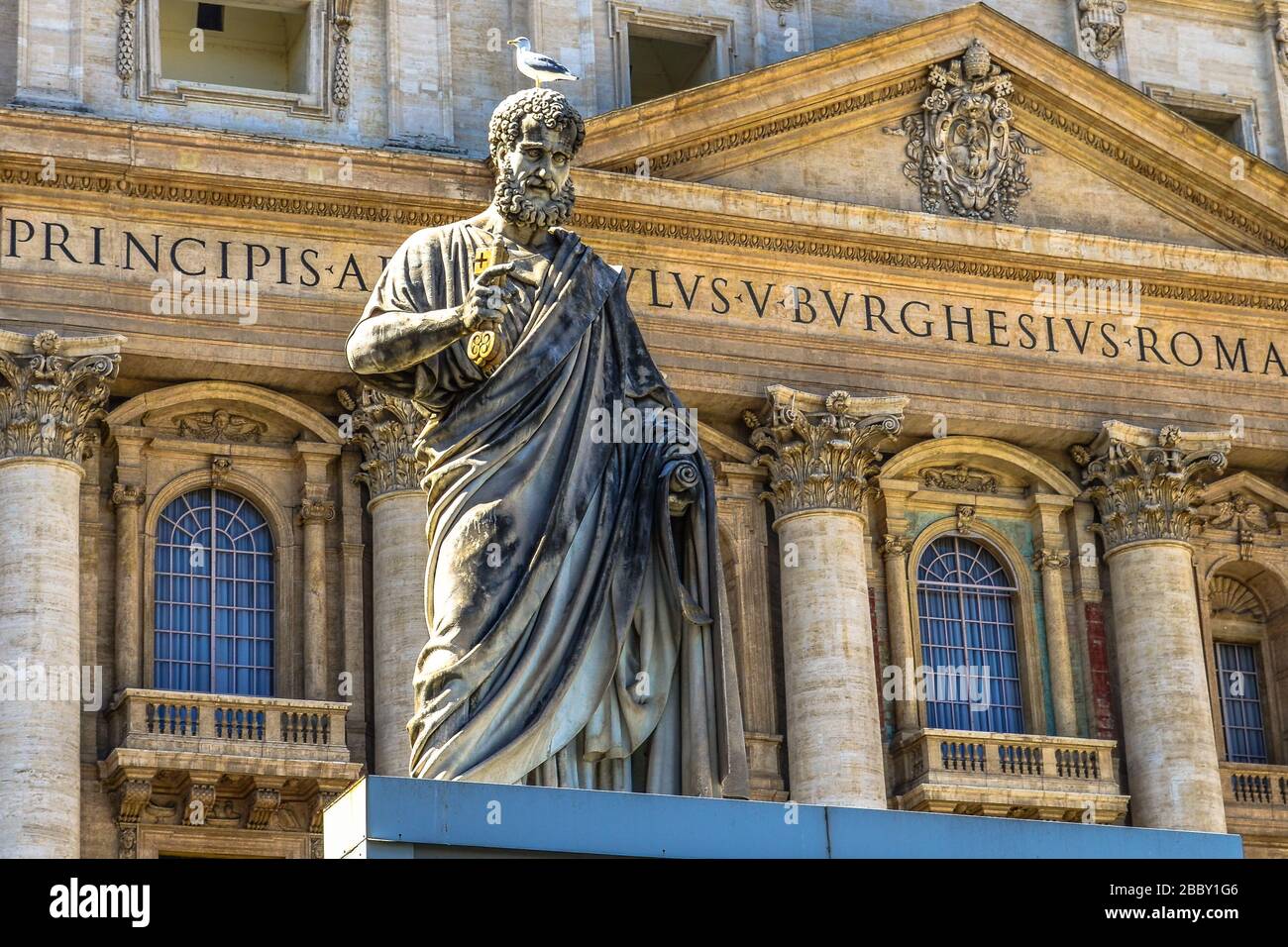 Statue of Saint Peter and Saint Peter's Basilica at background in St ...