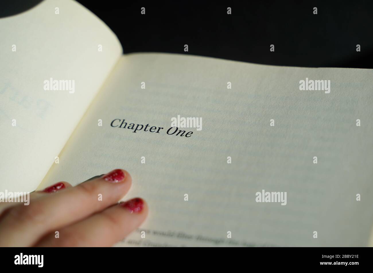 A title reading " Chapter One" in a serif font inside a book partially ...