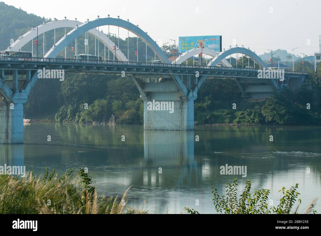 An arch bridge in a river Stock Photo - Alamy