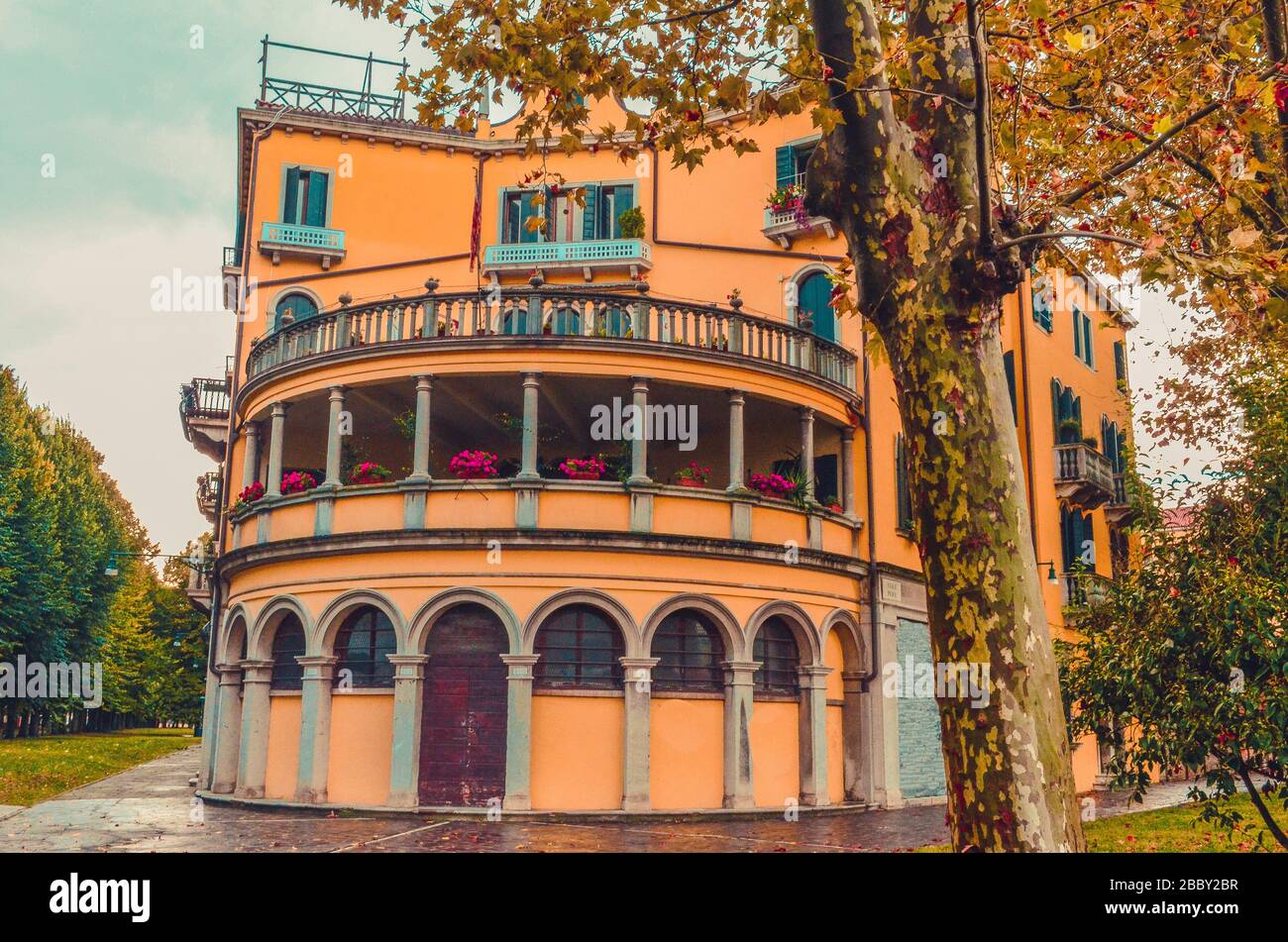 Old yellow house with a circular terrace, columns and an ancient ...