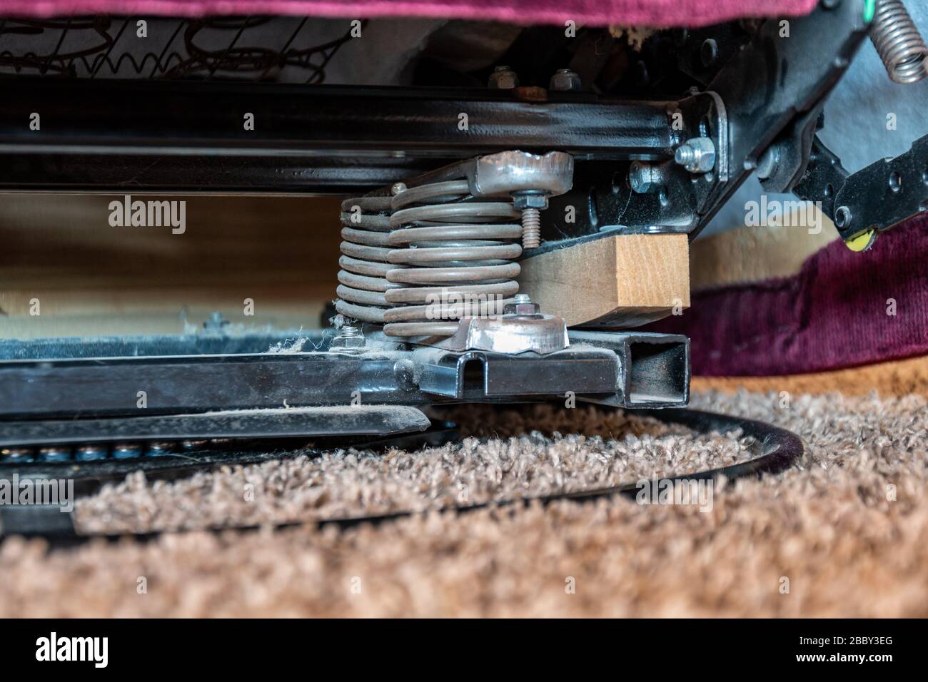 Spring and swivel under a reclining rocking chair Stock Photo - Alamy