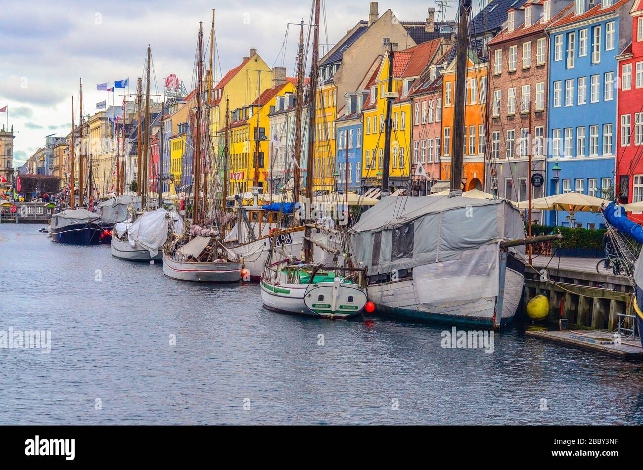 Nyhavn pier with color buildings and ships in Copenhagen, Denmark Stock ...