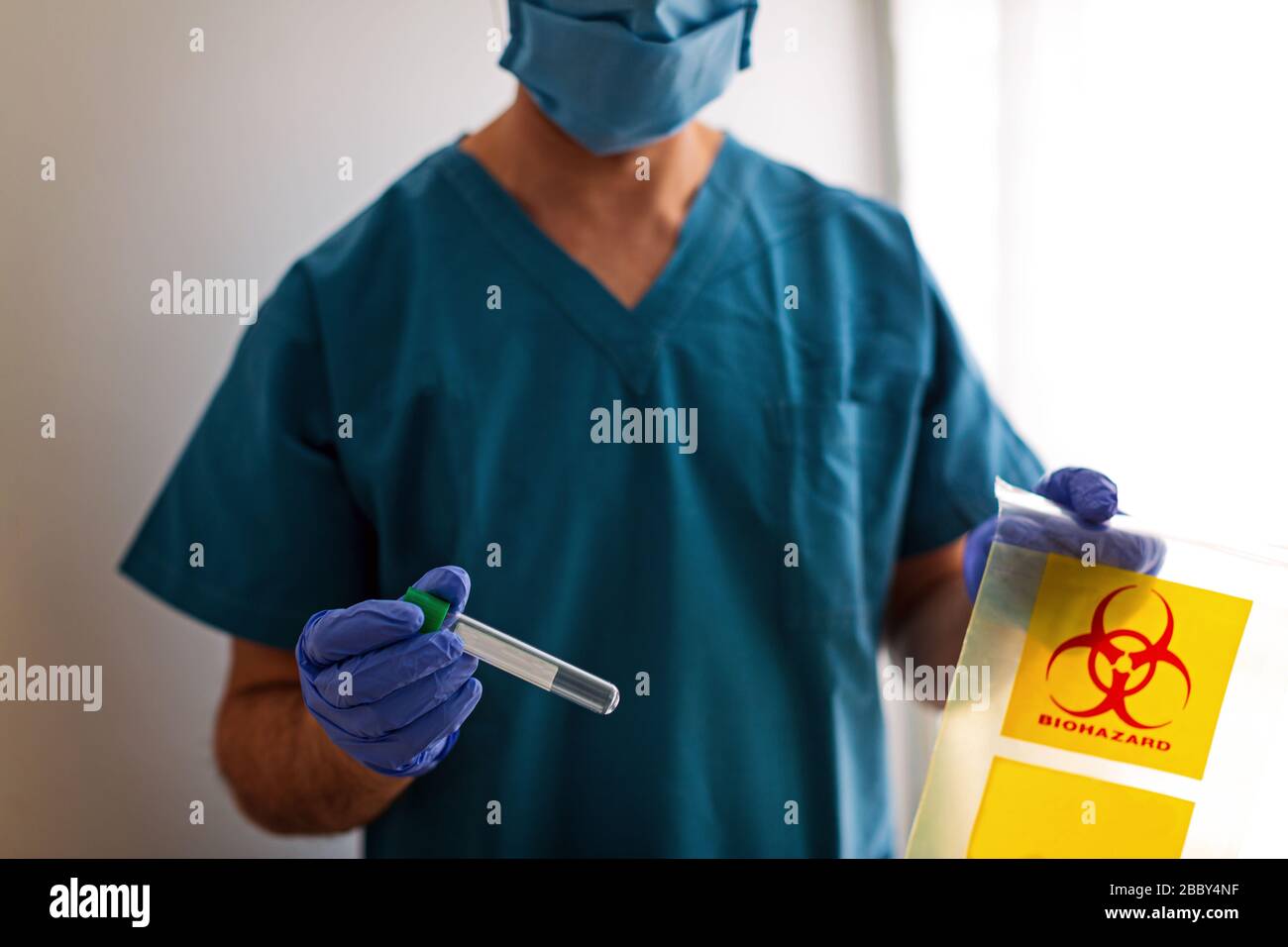 medical laboratory scientist holding a plastic bag containing test tube ... medical laboratory scientist holding a plastic bag containing test tube ...