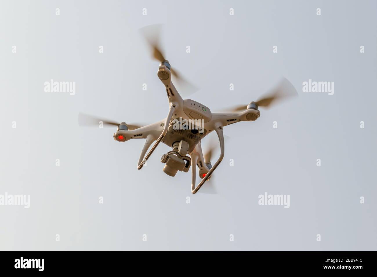 Modern RC Drone / Quadcopter with camera flying in a bright and clear ...