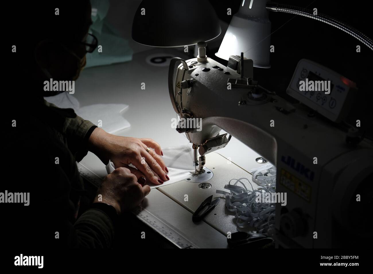Portland, USA. 01st Apr, 2020. A worker makes a face mask at the ...