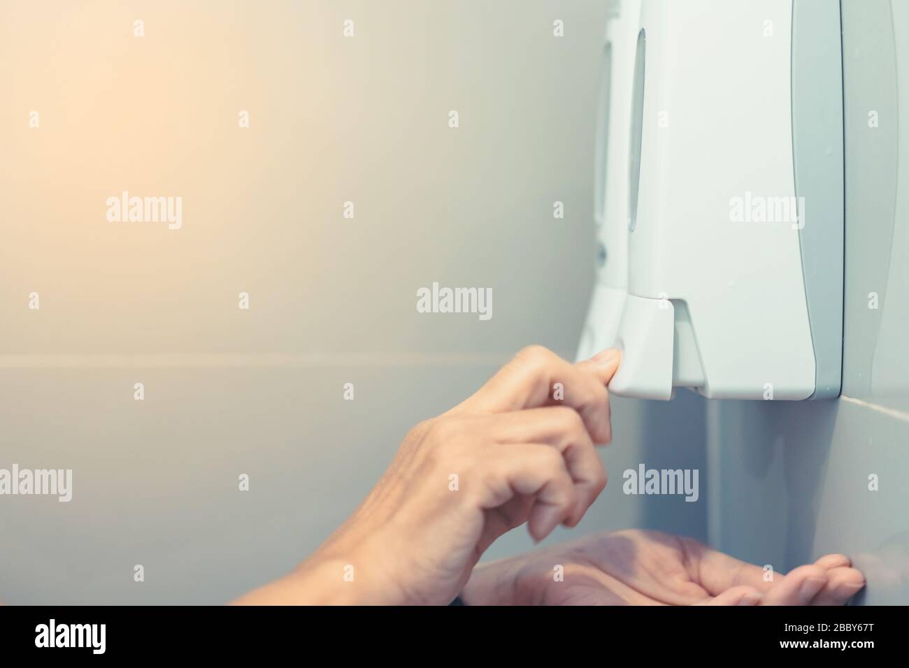 Close up to Hands of woman pumping soap with liquid soap press in the ...