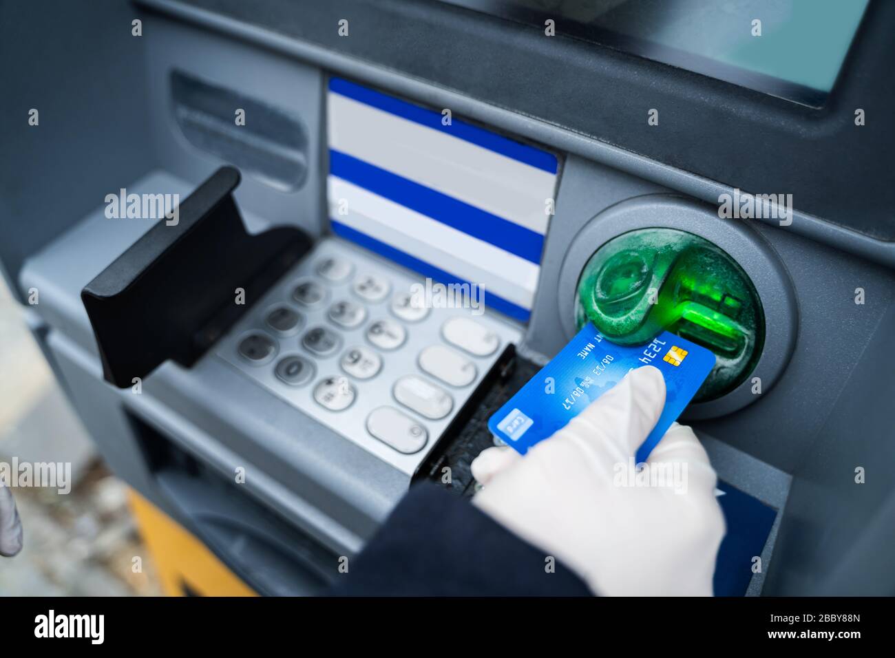 Person using atm hi-res stock photography and images - Alamy
